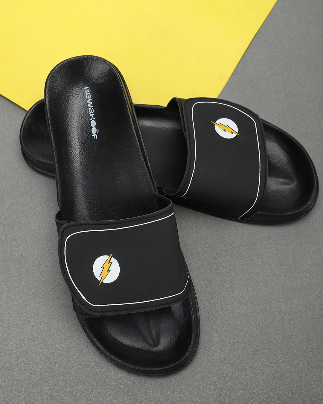 Buy Men's Black Flash Print Velcro Sliders Online in India at Bewakoof