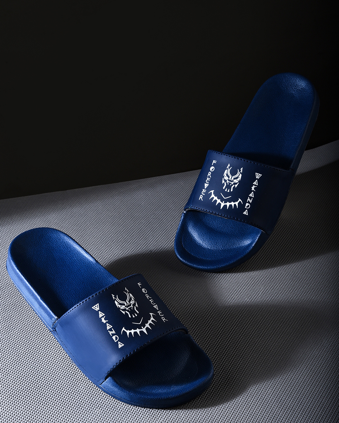 Buy Men White Wakanda Forever Graphic Printed Sliders Online in India ...